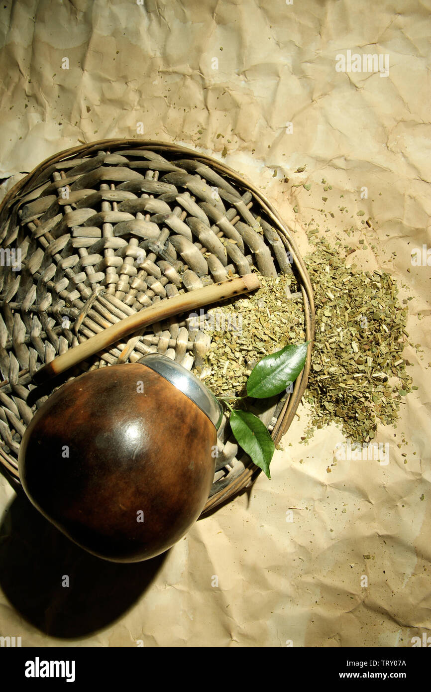 Calabash and bombilla with yerba mate on old paper background Stock ...