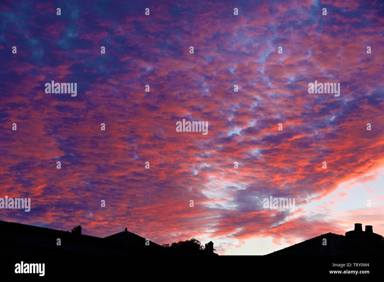 Sunset sky with house rooftops. Beast Banks, Kendal, Cumbria, England ...