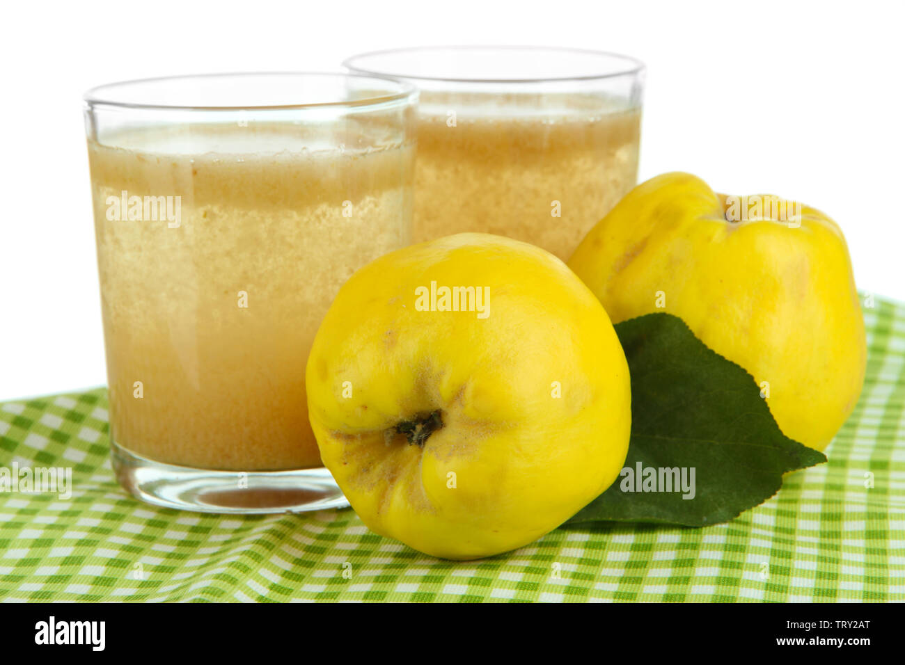 Sweet quince with juice on table on white background Stock Photo - Alamy