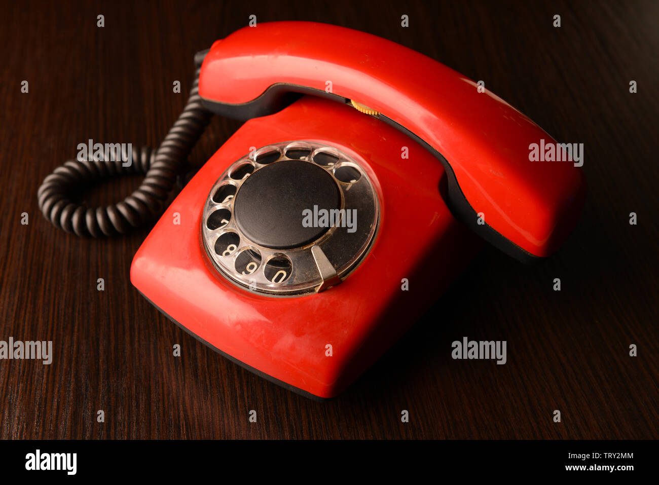 Red retro telephone,on dark background Stock Photo - Alamy