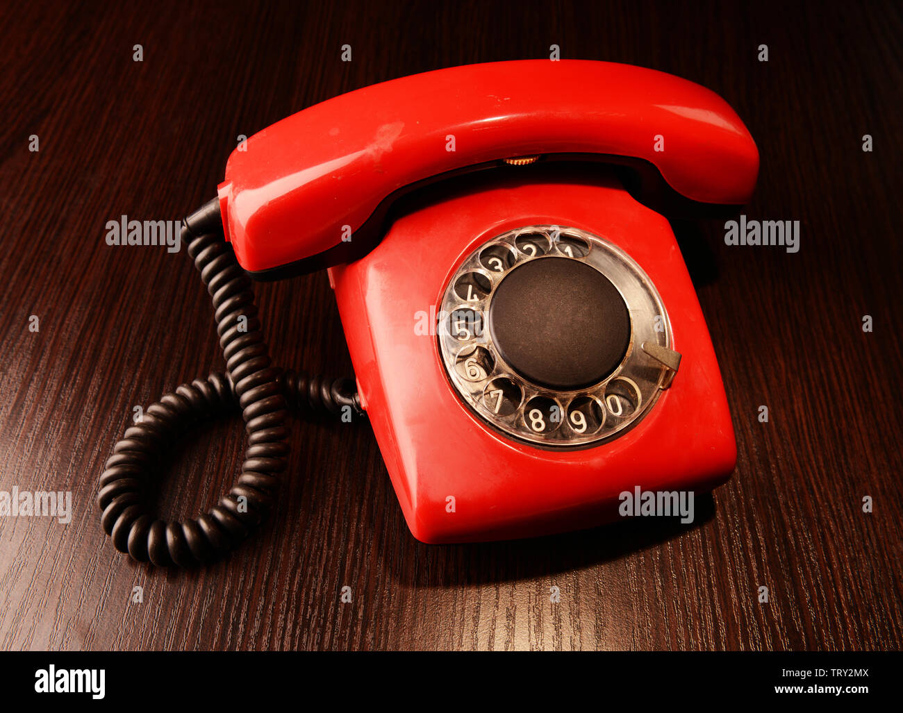 Red retro telephone,on dark background Stock Photo - Alamy