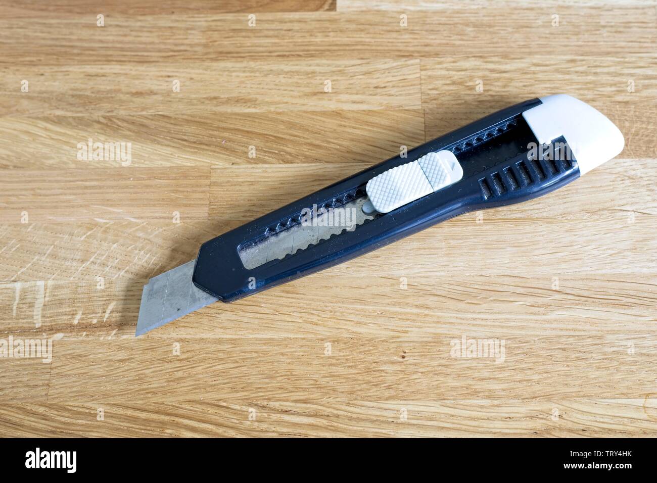 Trimming knife with a retractable snap off blade Stock Photo - Alamy