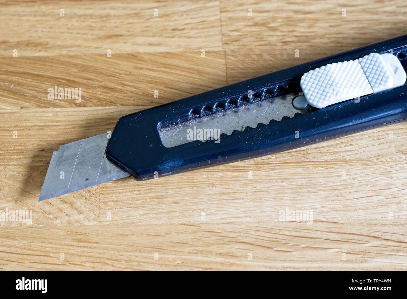 Trimming knife with a retractable snap off blade Stock Photo - Alamy