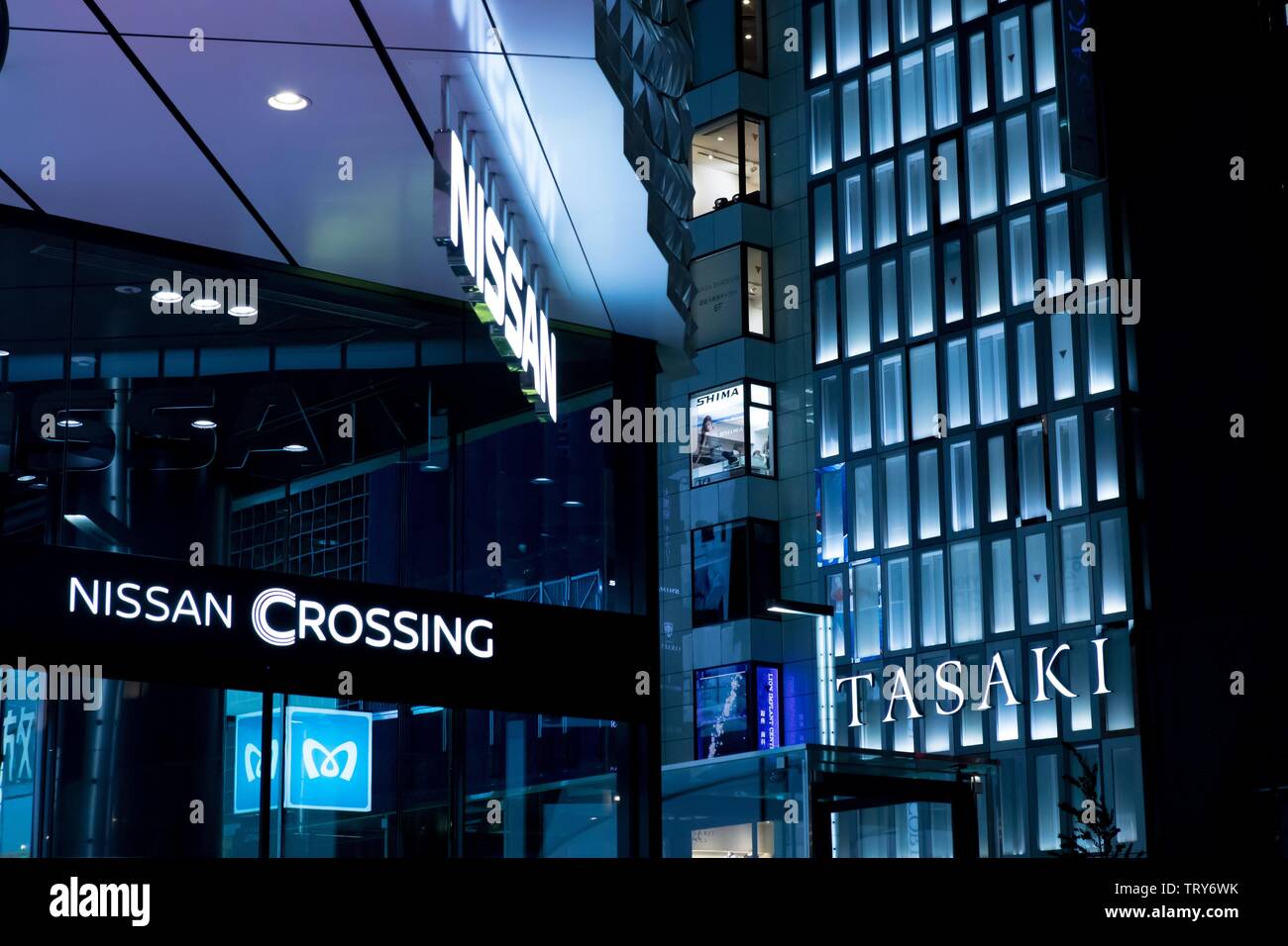 Neon- and glass facades in the fancy shopping district Ginza, in April ...