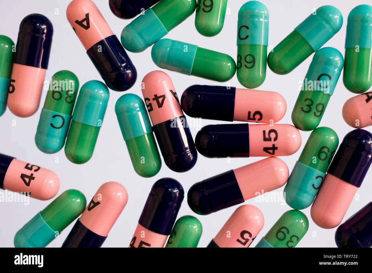 Clindamycin Capsules (green) and Amoxicillin Capsules on a white ...