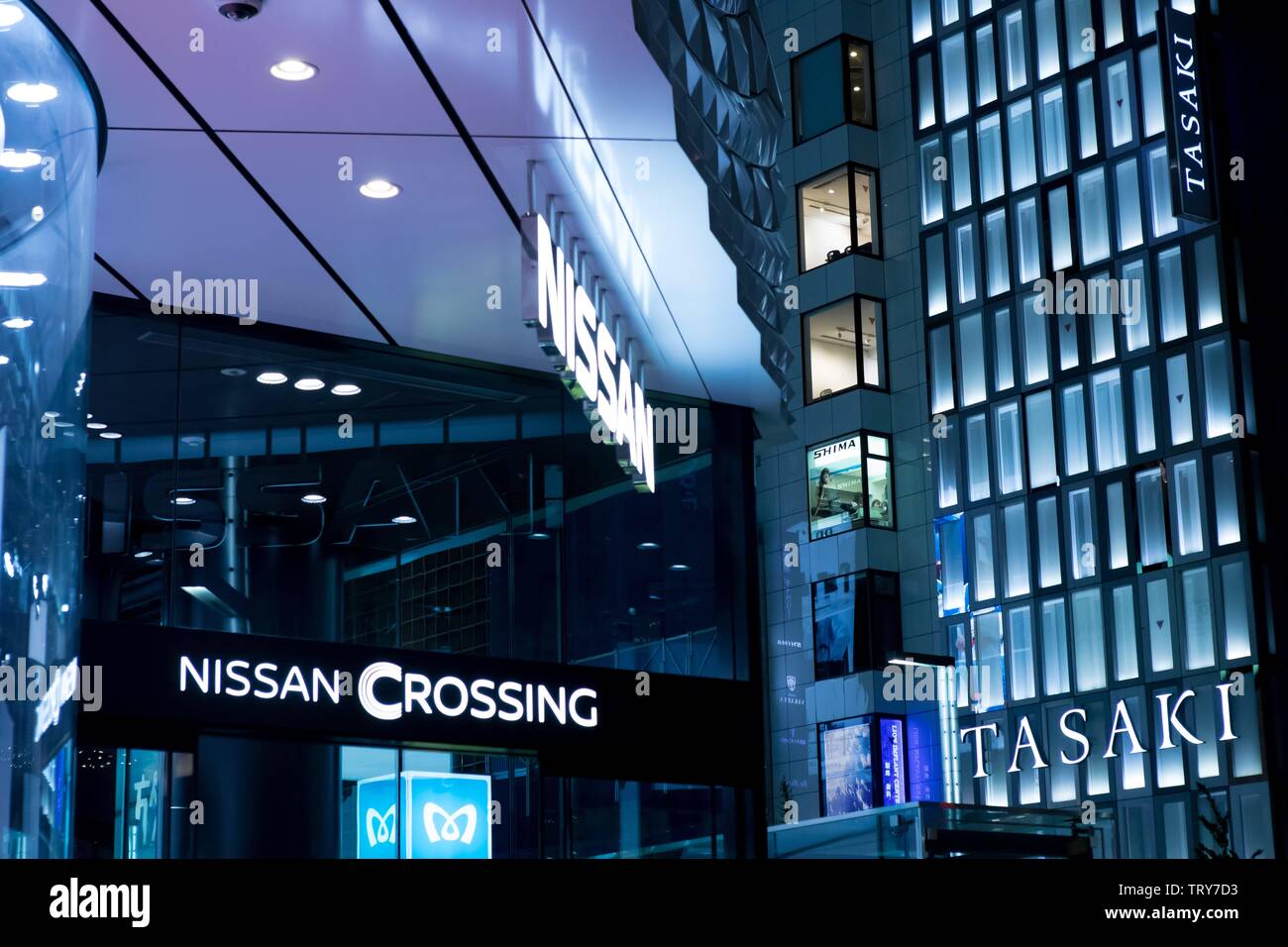 Neon- and glass facades in the fancy shopping district Ginza, in April ...