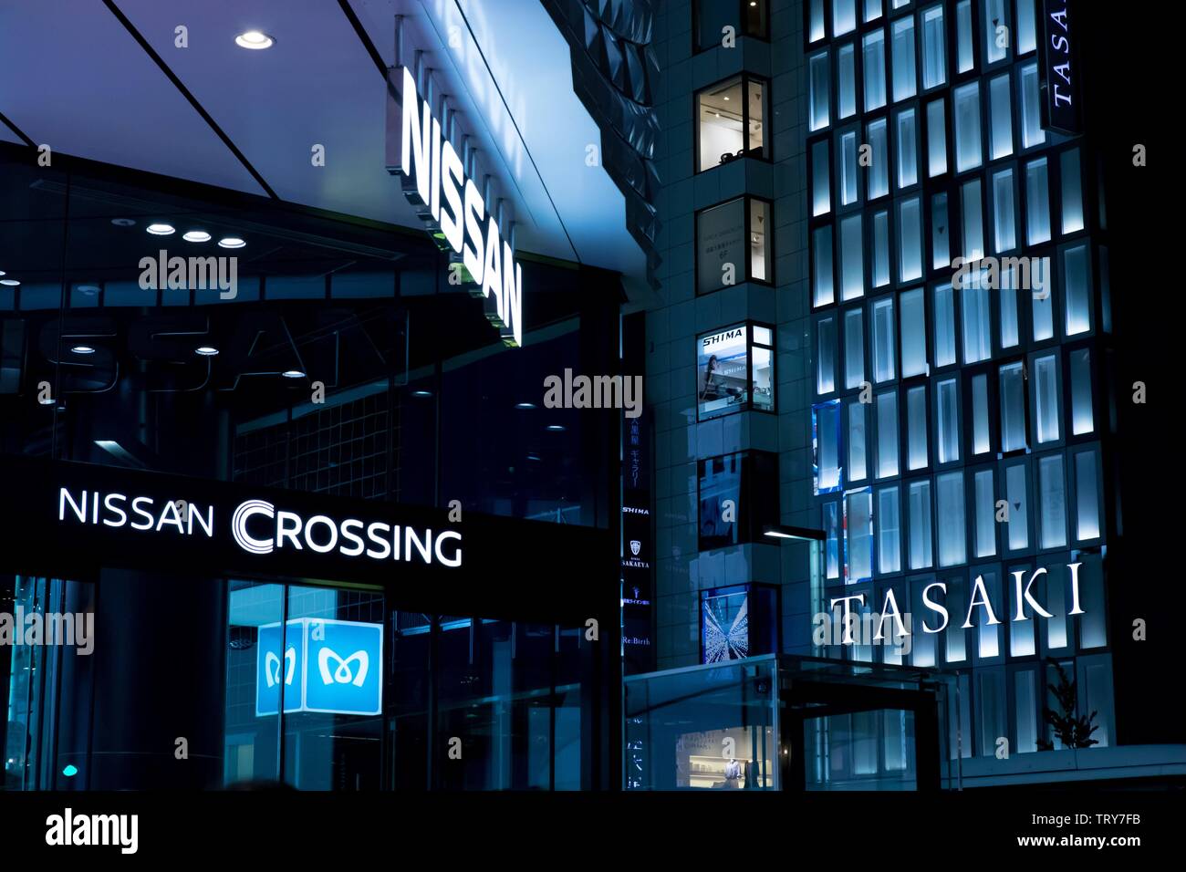 Neon- and glass facades in the fancy shopping district Ginza, in April ...