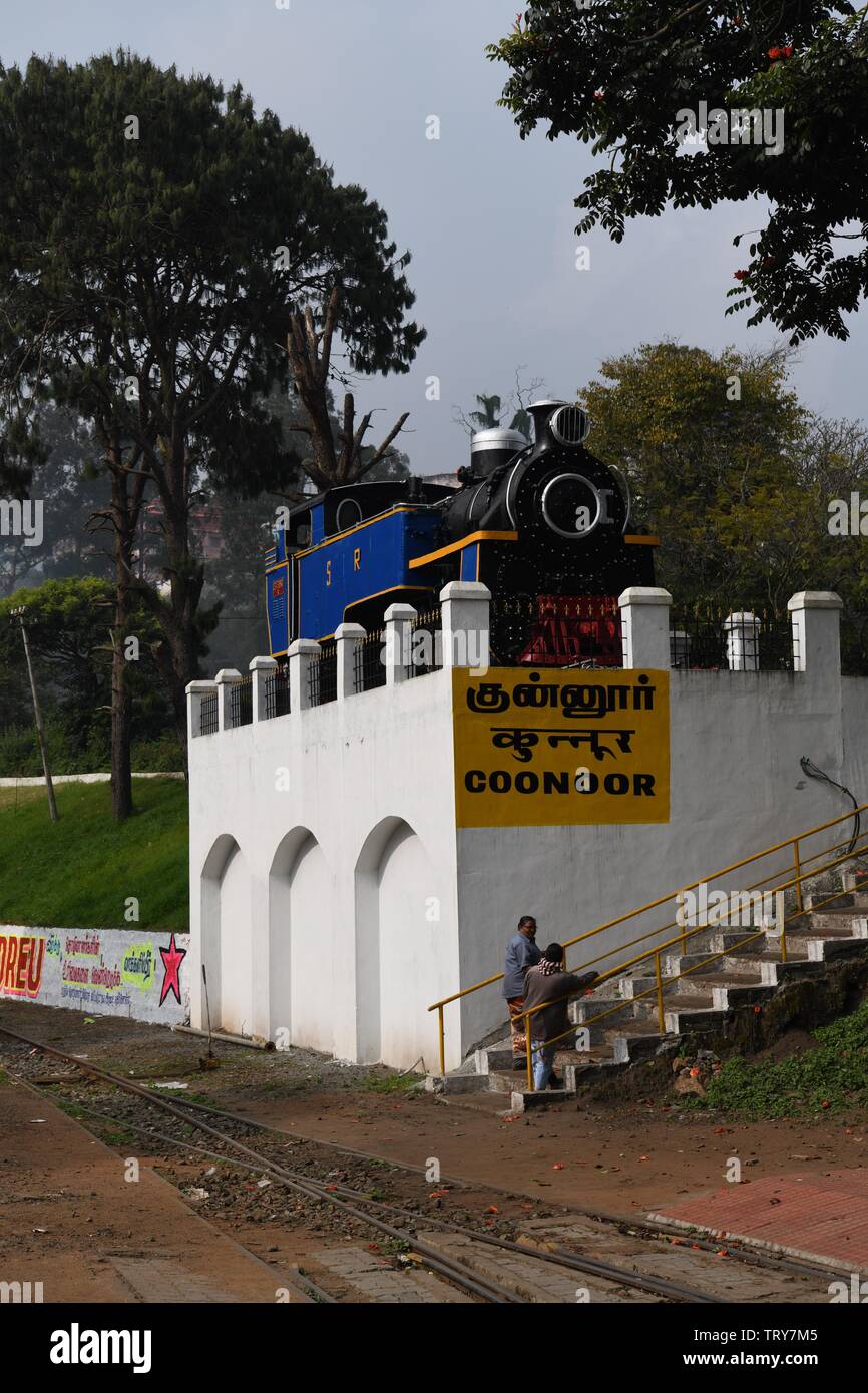 Nilgiri mountain railway. Old steam locomotive on plinth at end of ...