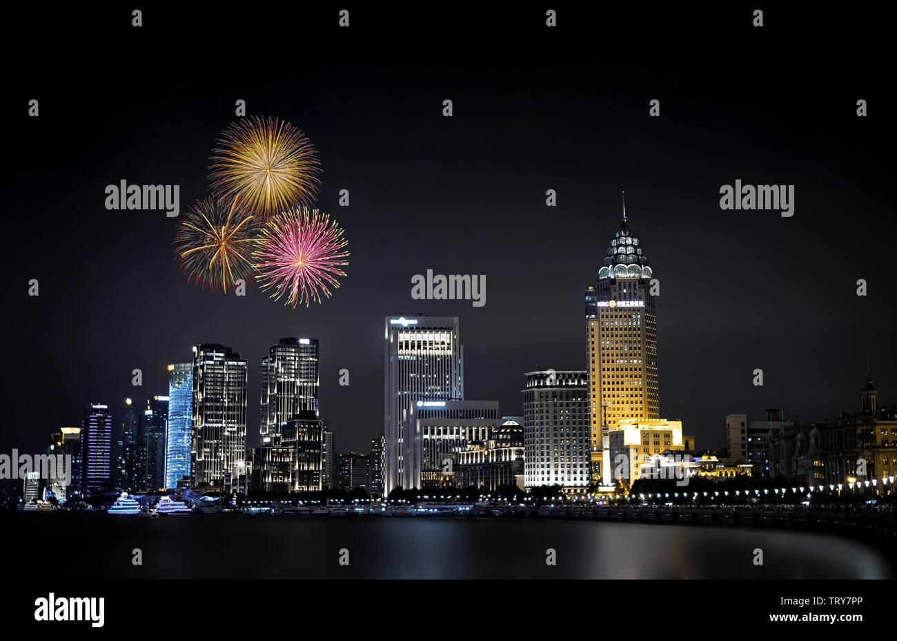 Bustling city night scene, fireworks bloom sky Stock Photo - Alamy