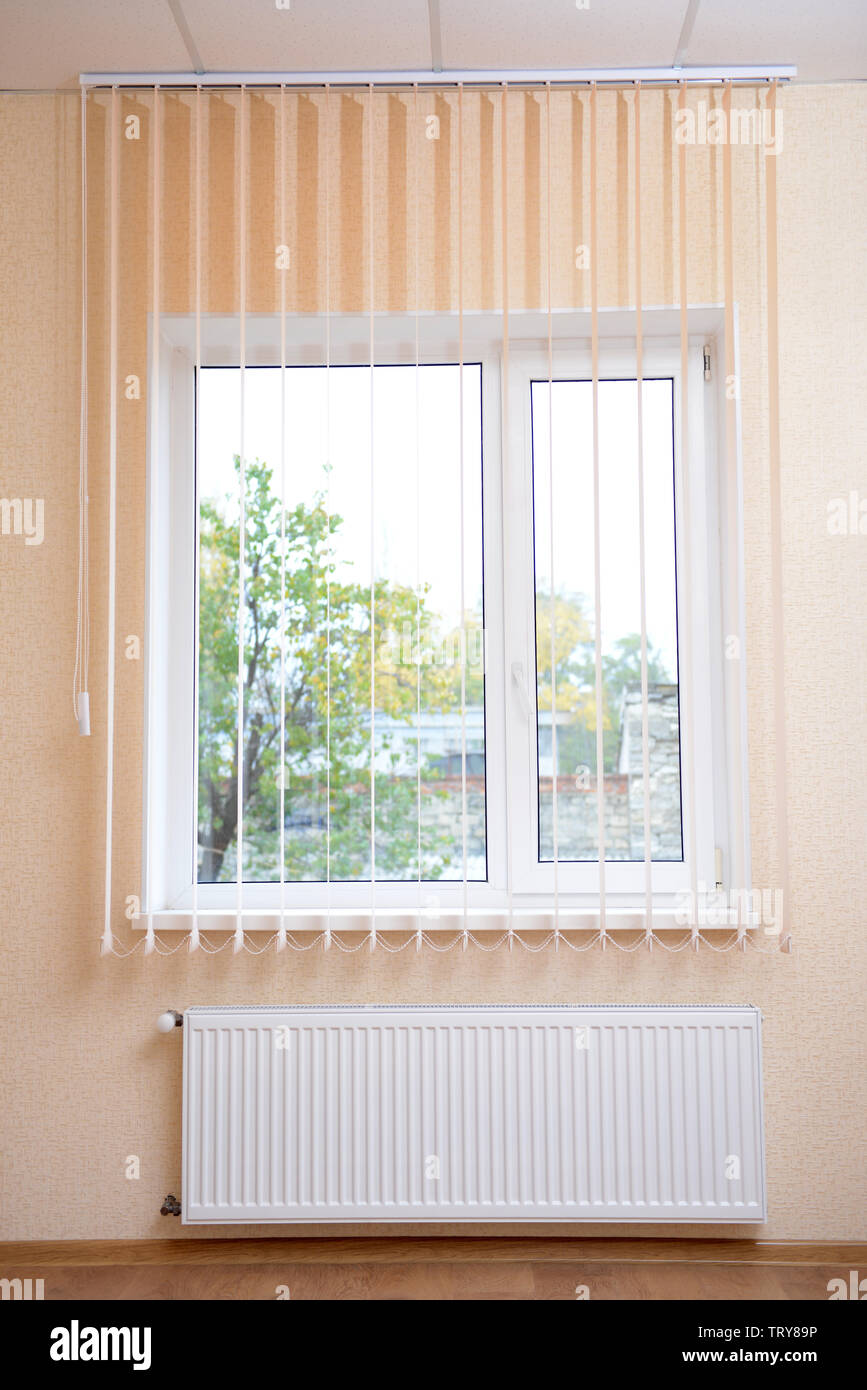 Photo heating radiator under window Stock Photo - Alamy