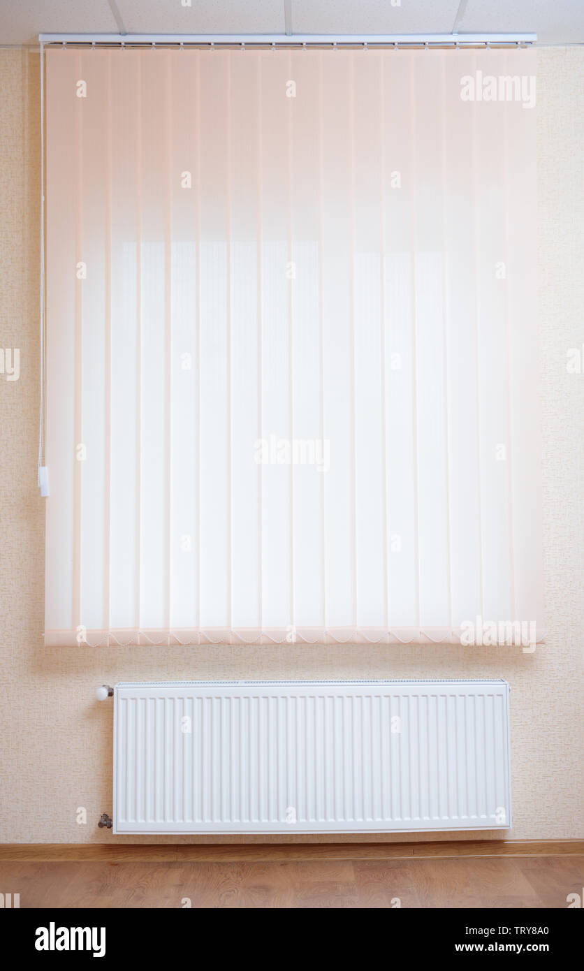 Photo heating radiator under window Stock Photo - Alamy