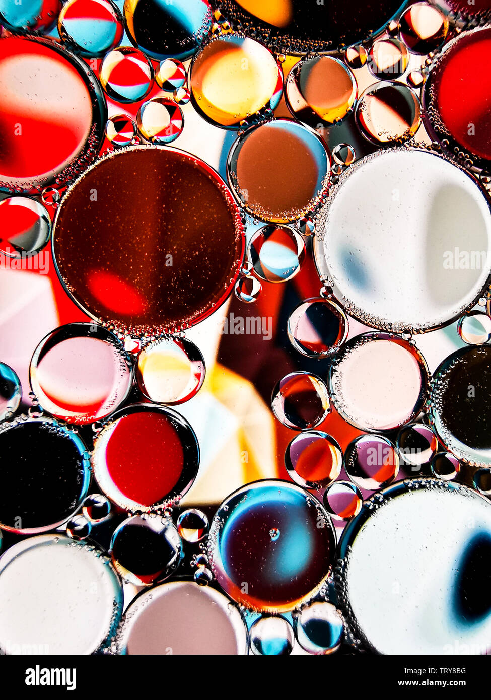 red oil bubbles macro patterns texture abstract Stock Photo - Alamy