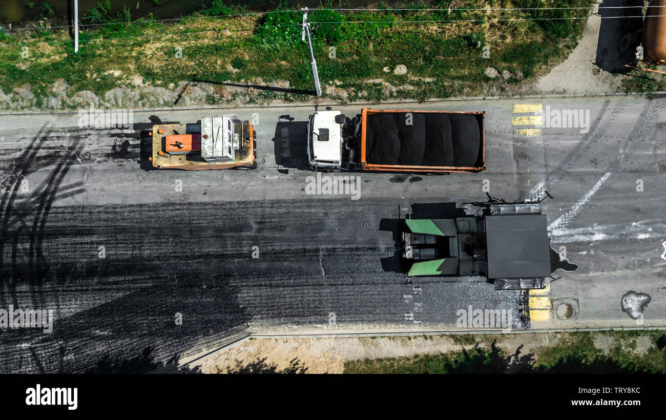 Aerial view on the new asphalt road under construction Stock Photo - Alamy