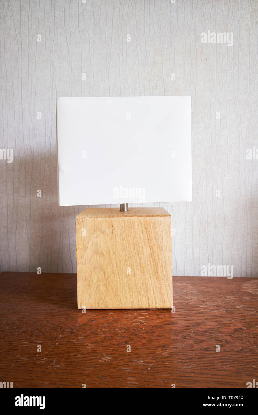 Plain, simple, minimalist lamp on a dresser Stock Photo - Alamy