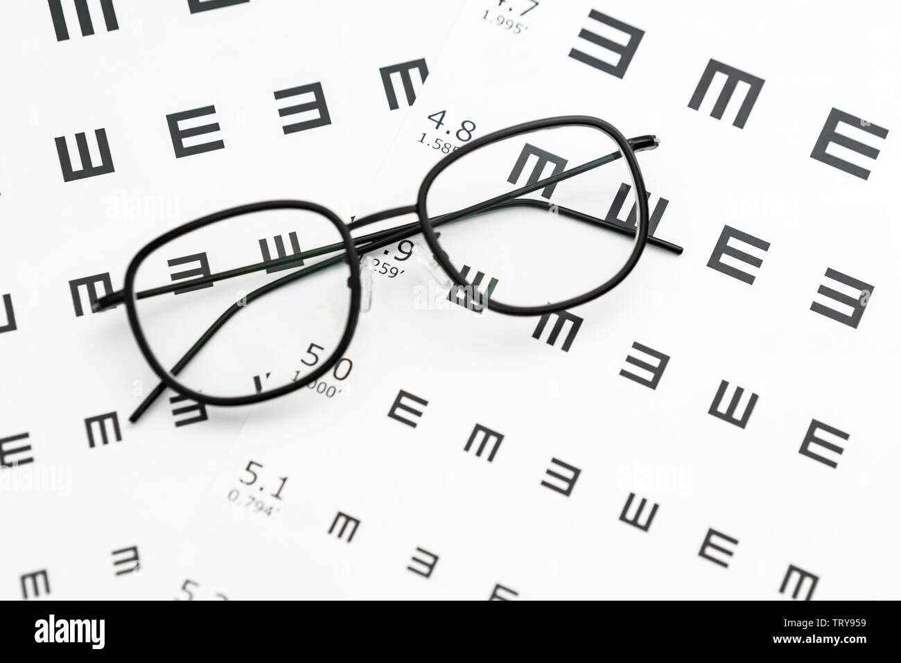 Black glasses and visual meter on white background Stock Photo - Alamy