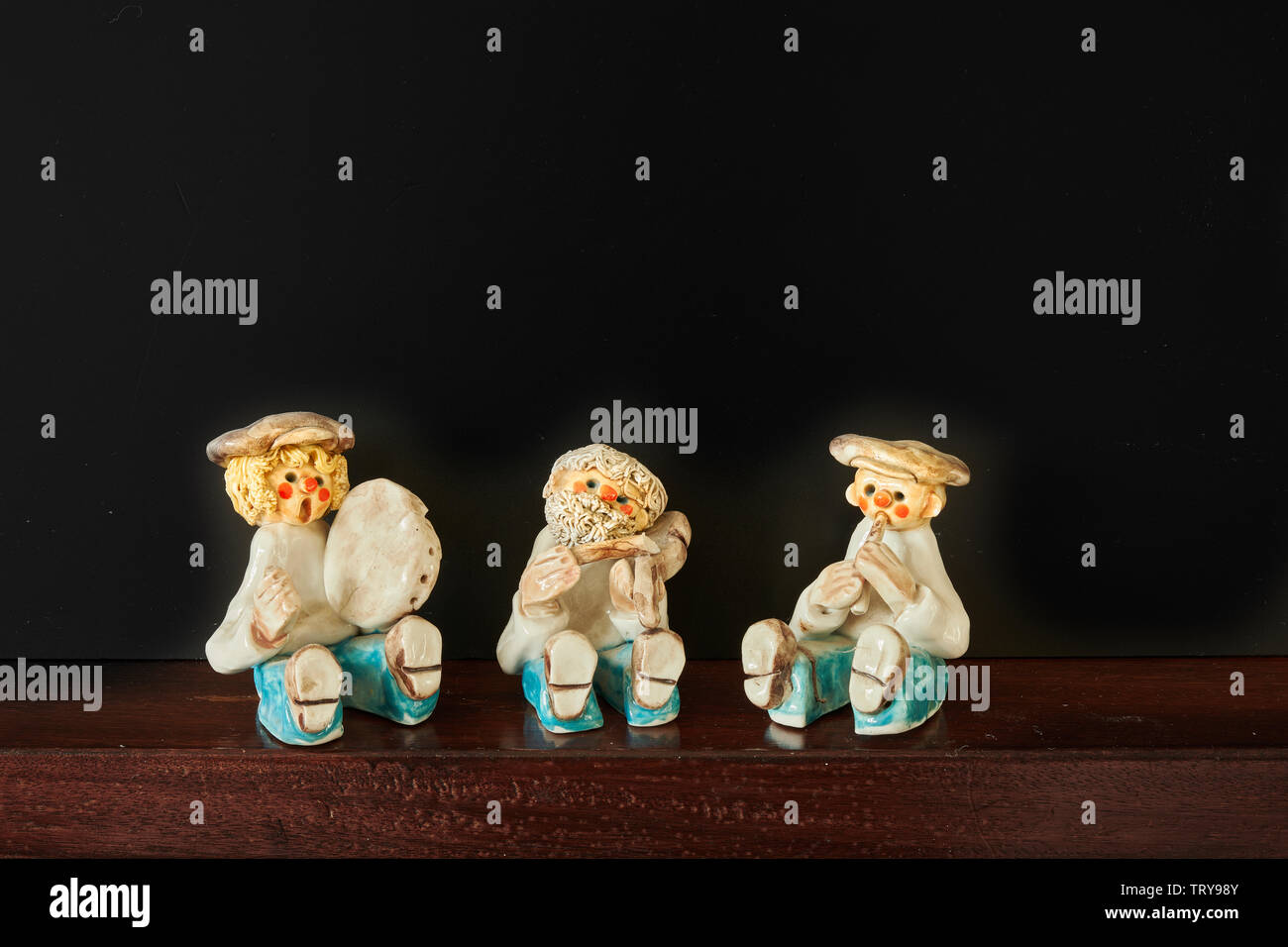 A trio of musicians figures crafted in ceramics Stock Photo - Alamy