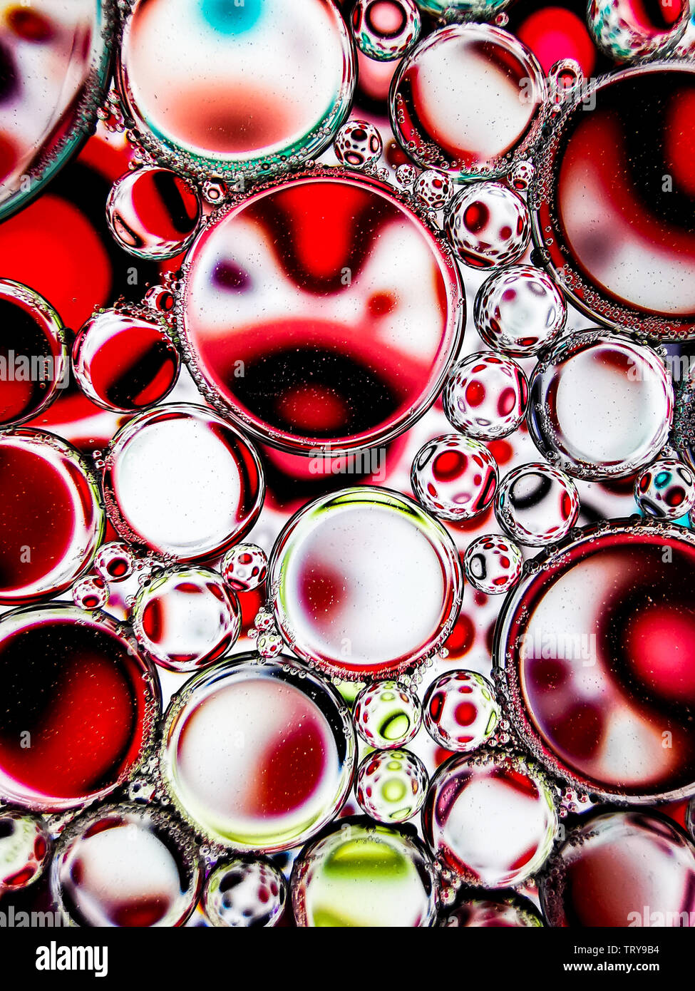 red oil bubbles macro patterns texture abstract Stock Photo - Alamy