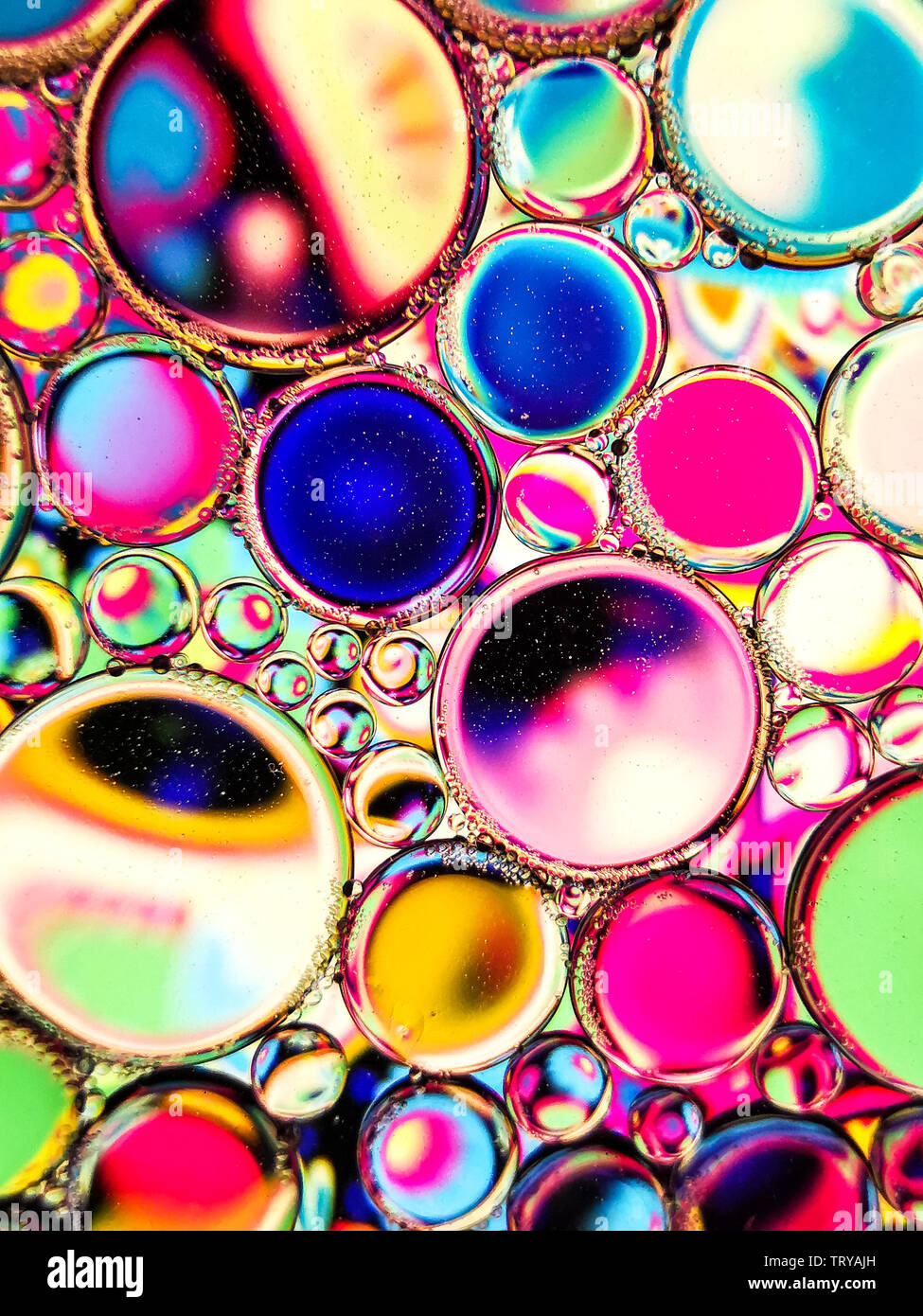 magenta cyan oil bubbles abstract textures Stock Photo - Alamy