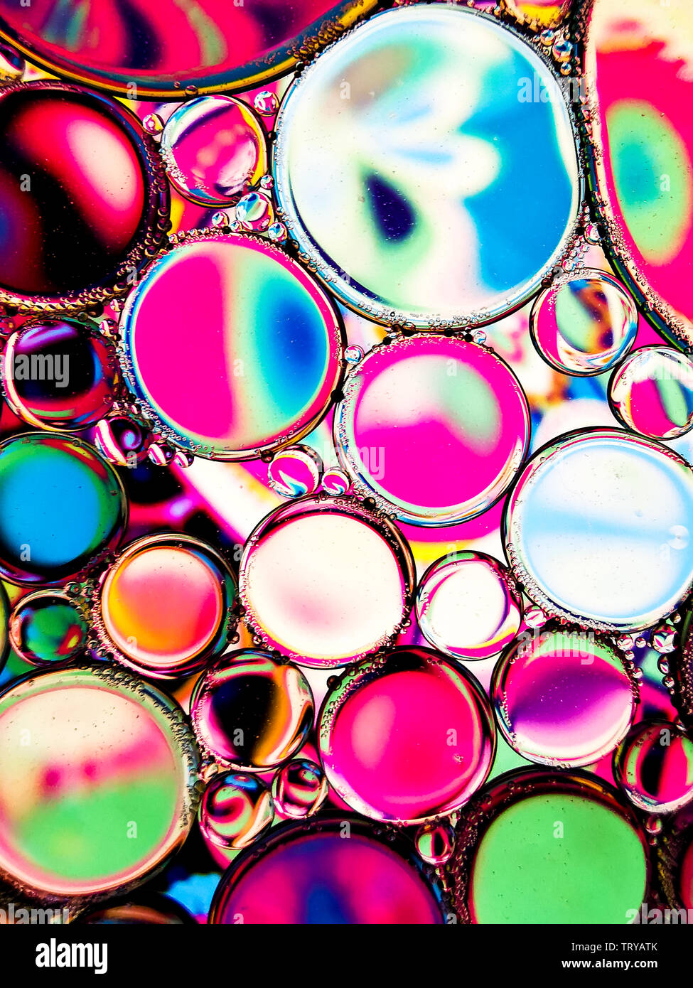 magenta cyan oil bubbles abstract textures Stock Photo - Alamy