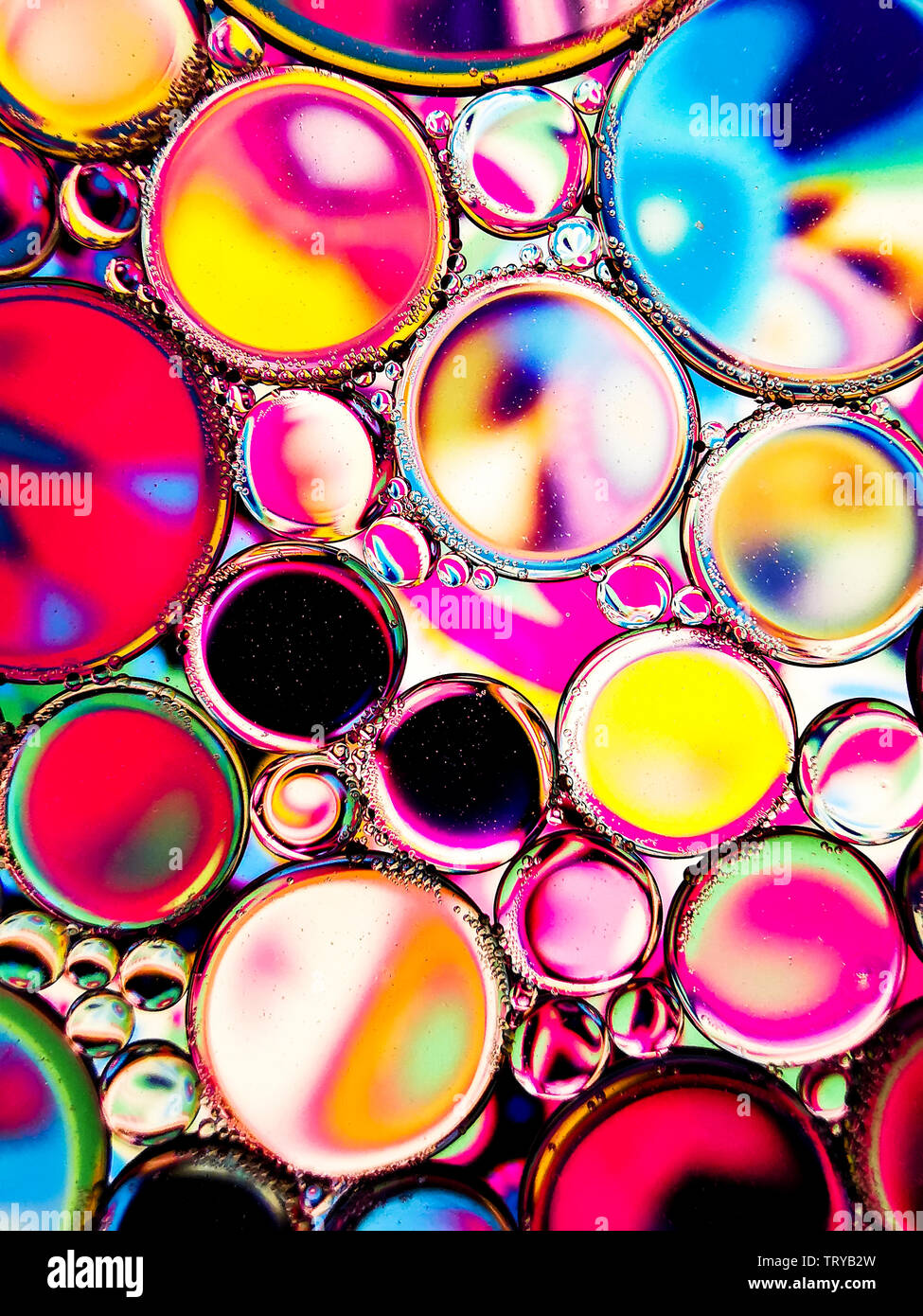 magenta cyan oil bubbles abstract textures Stock Photo - Alamy