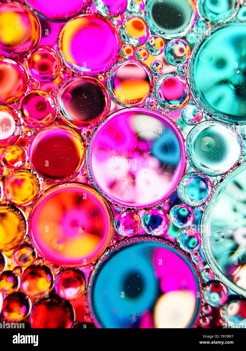 magenta cyan oil bubbles abstract textures Stock Photo - Alamy