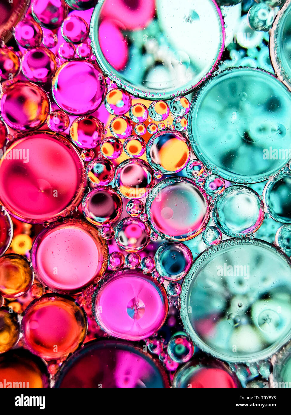 magenta cyan oil bubbles abstract textures Stock Photo - Alamy