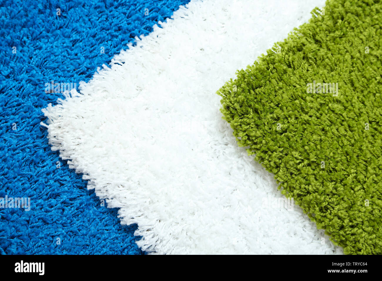 Many carpets of different colors close-up Stock Photo - Alamy