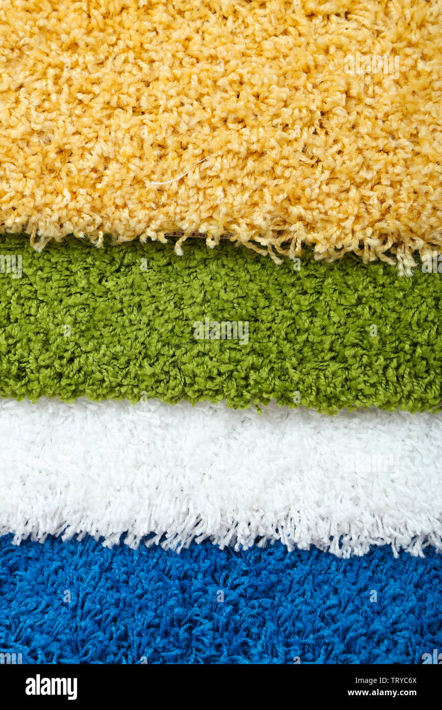Many carpets of different colors close-up Stock Photo - Alamy