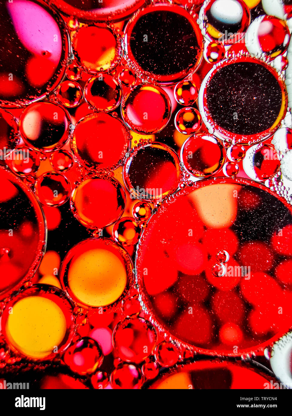 red oil bubbles macro patterns texture abstract Stock Photo - Alamy
