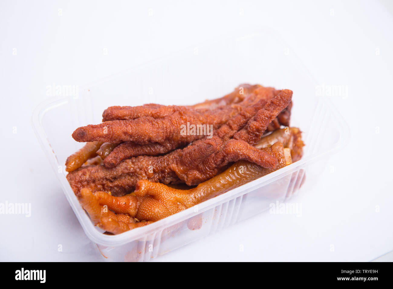halogen chicken claws Stock Photo - Alamy