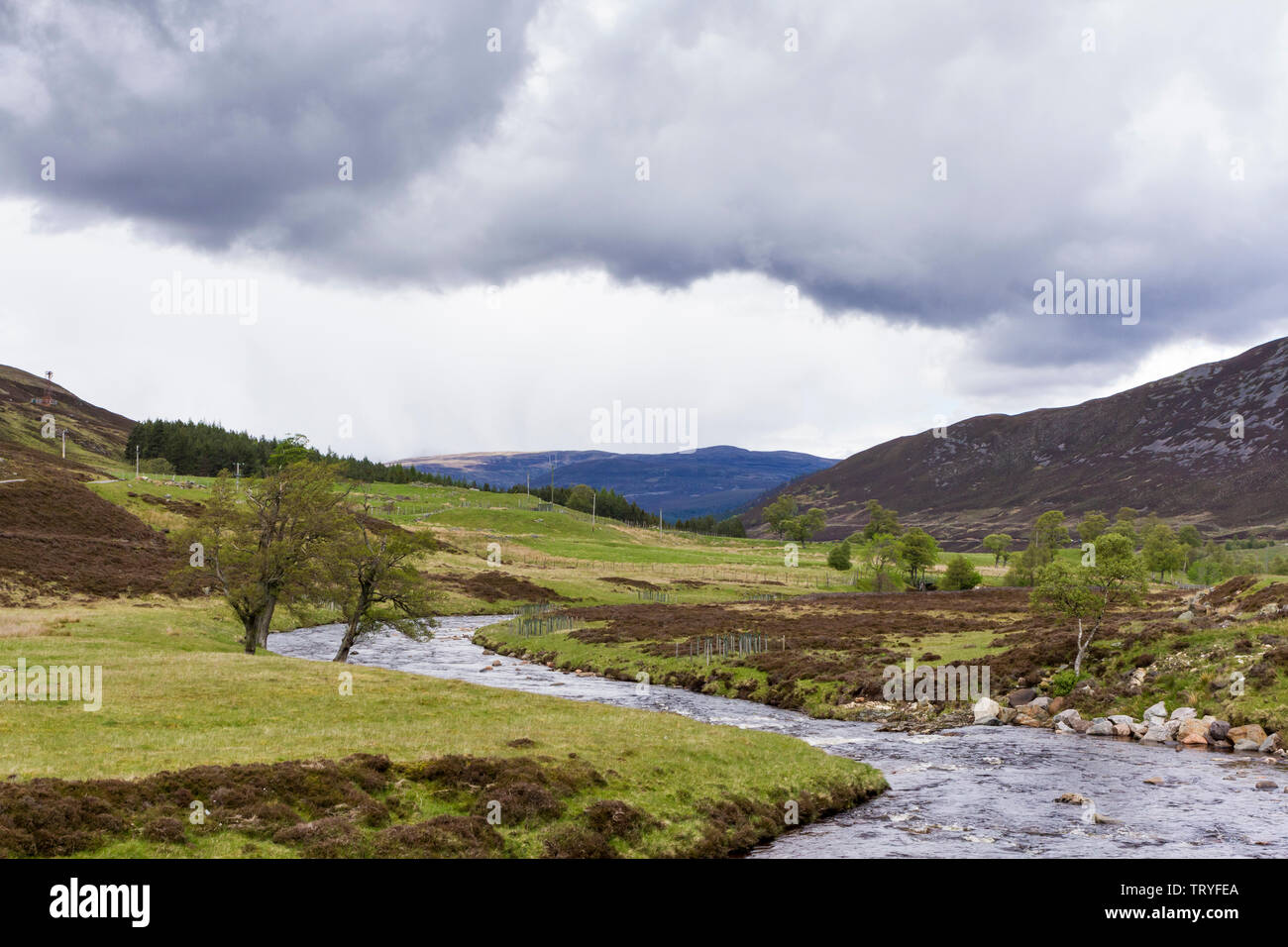 View Clunie Water river and mountains in the Cairngorms National Park ...