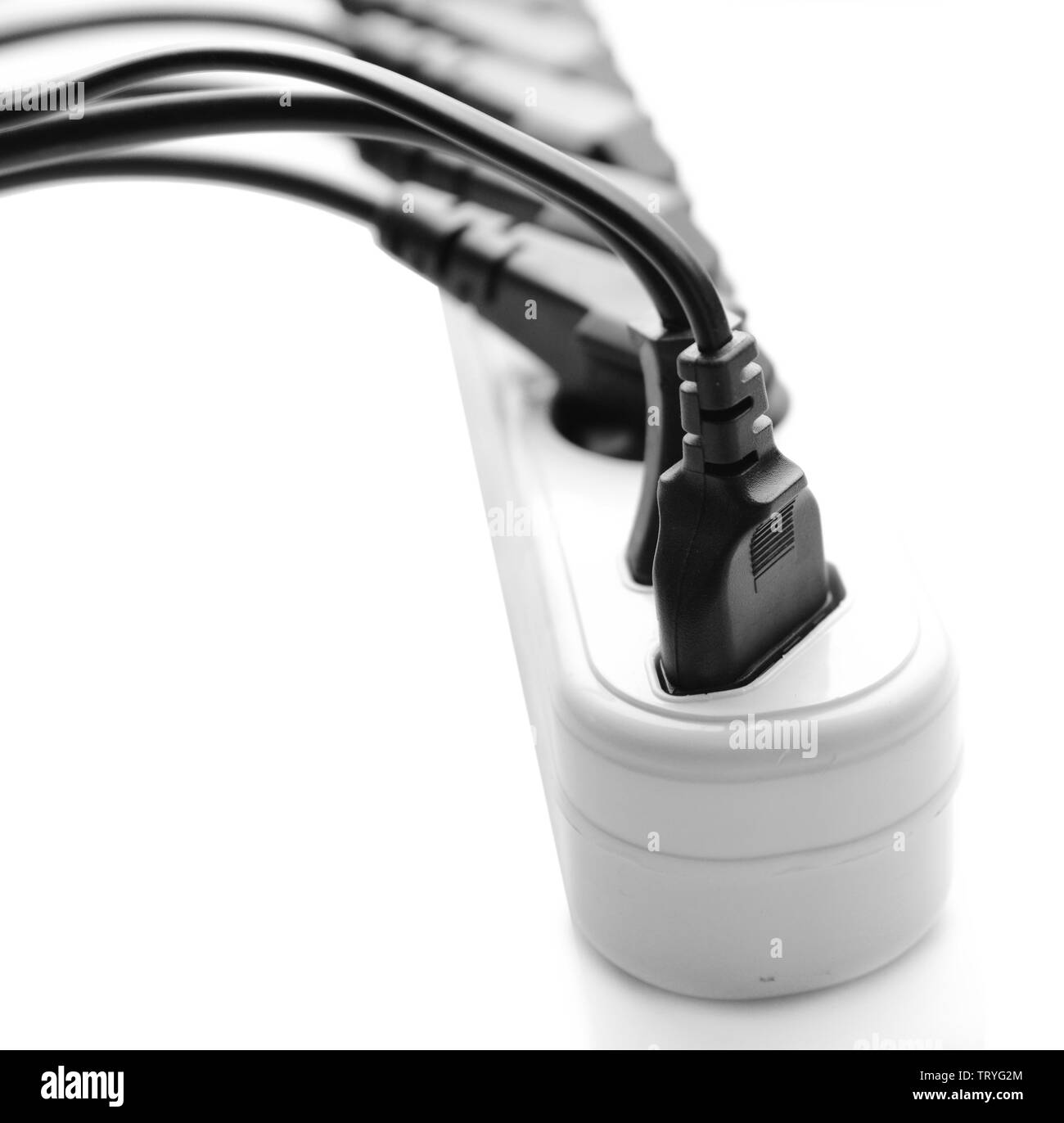 Overloaded power board, isolated on white Stock Photo - Alamy