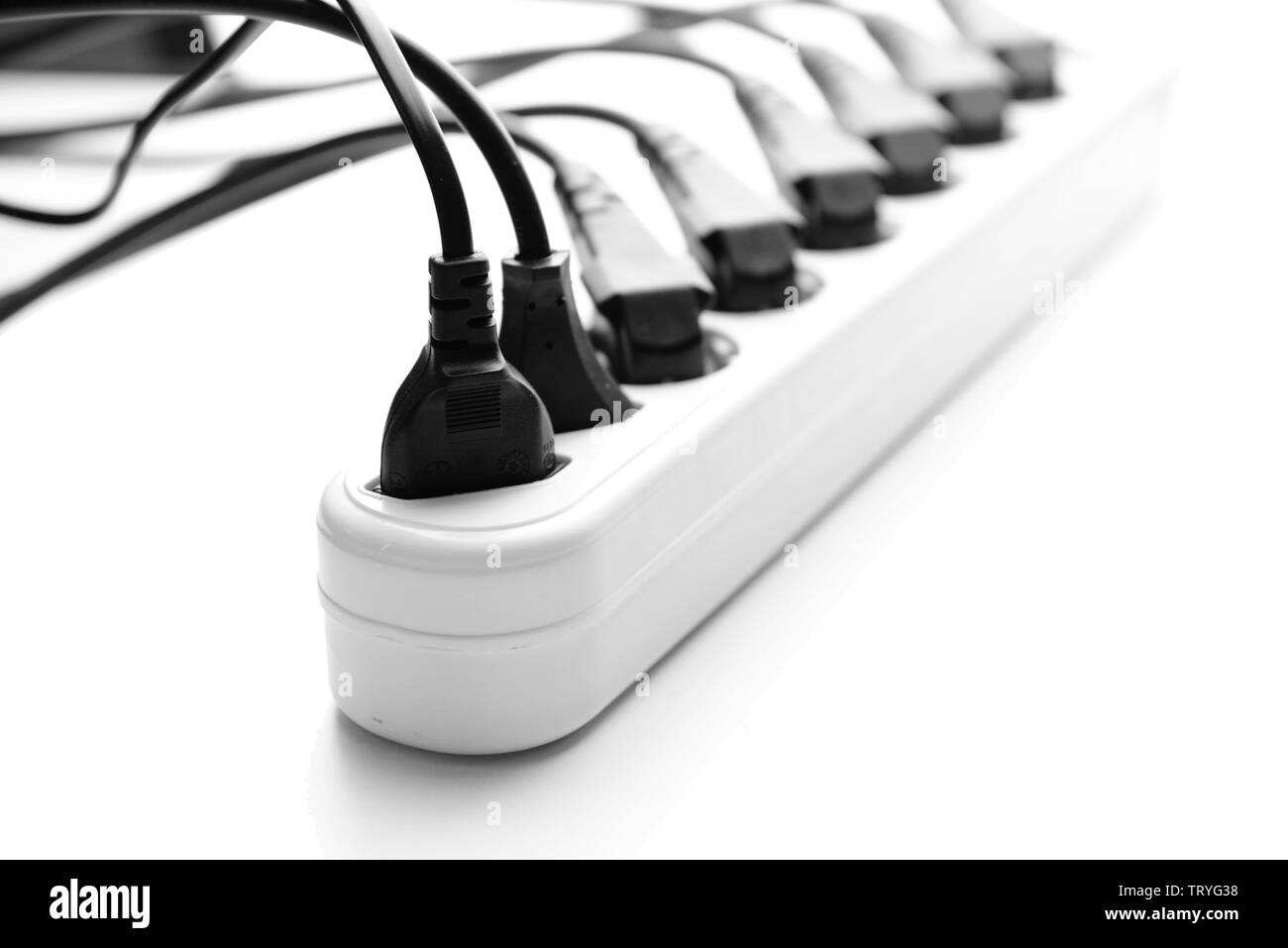 Overloaded power board, isolated on white Stock Photo - Alamy