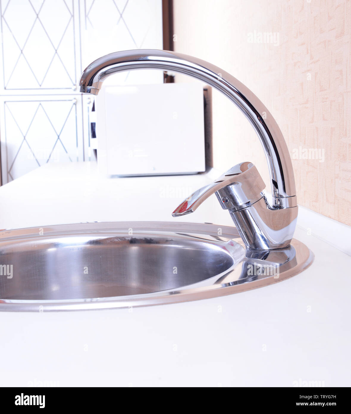 Water tap and sink in modern kitchen Stock Photo - Alamy