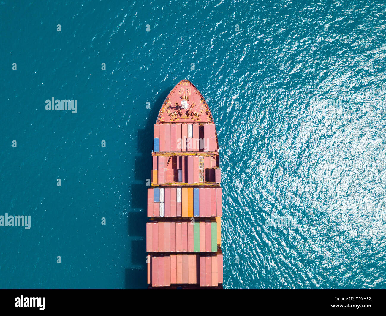 Aerial image of a large container ship at sea, loaded with various ...
