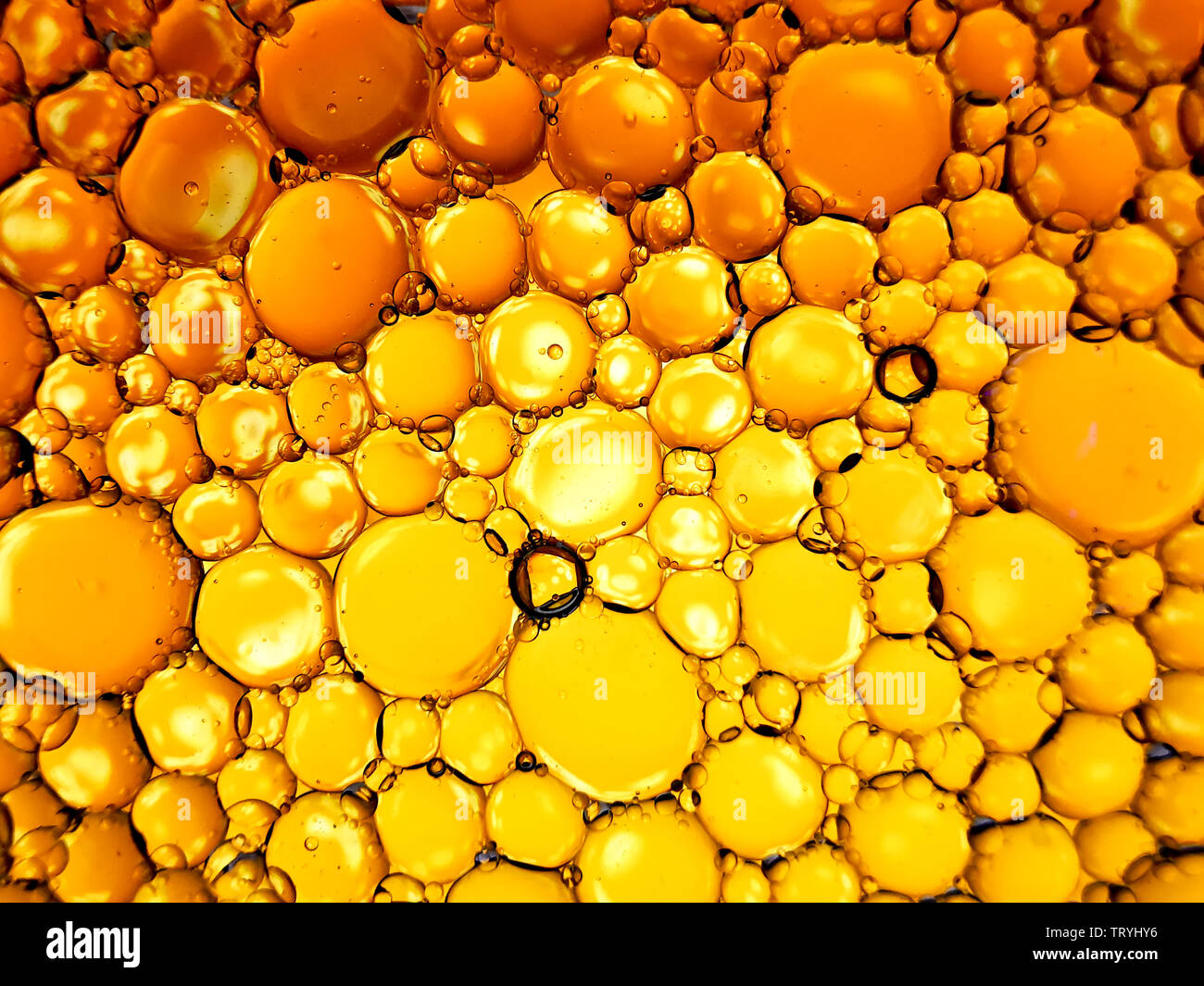 gold yellow beer oil organic abstract texture pattern bubbles macro ...
