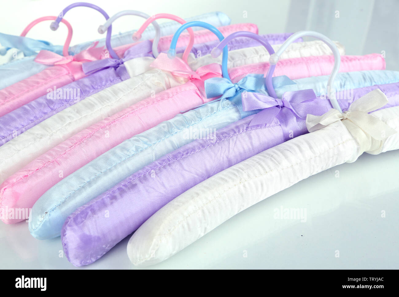 Beautiful hangers isolated on white Stock Photo - Alamy