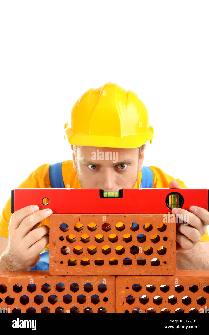 Portrait of young builder isolated on white Stock Photo - Alamy