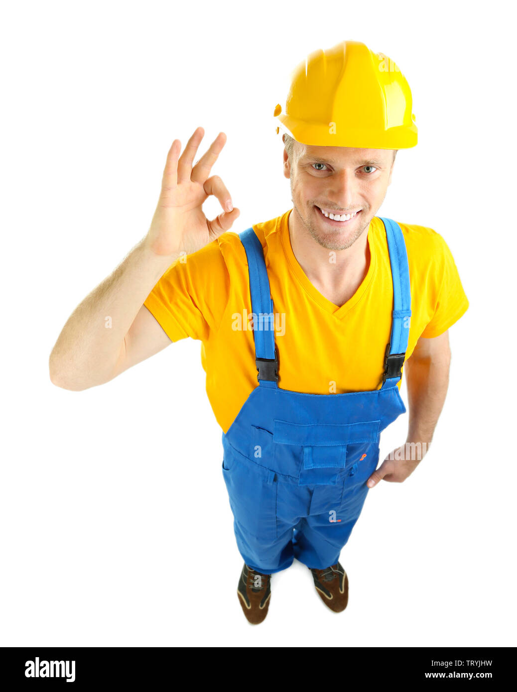 Portrait of young builder isolated on white Stock Photo - Alamy