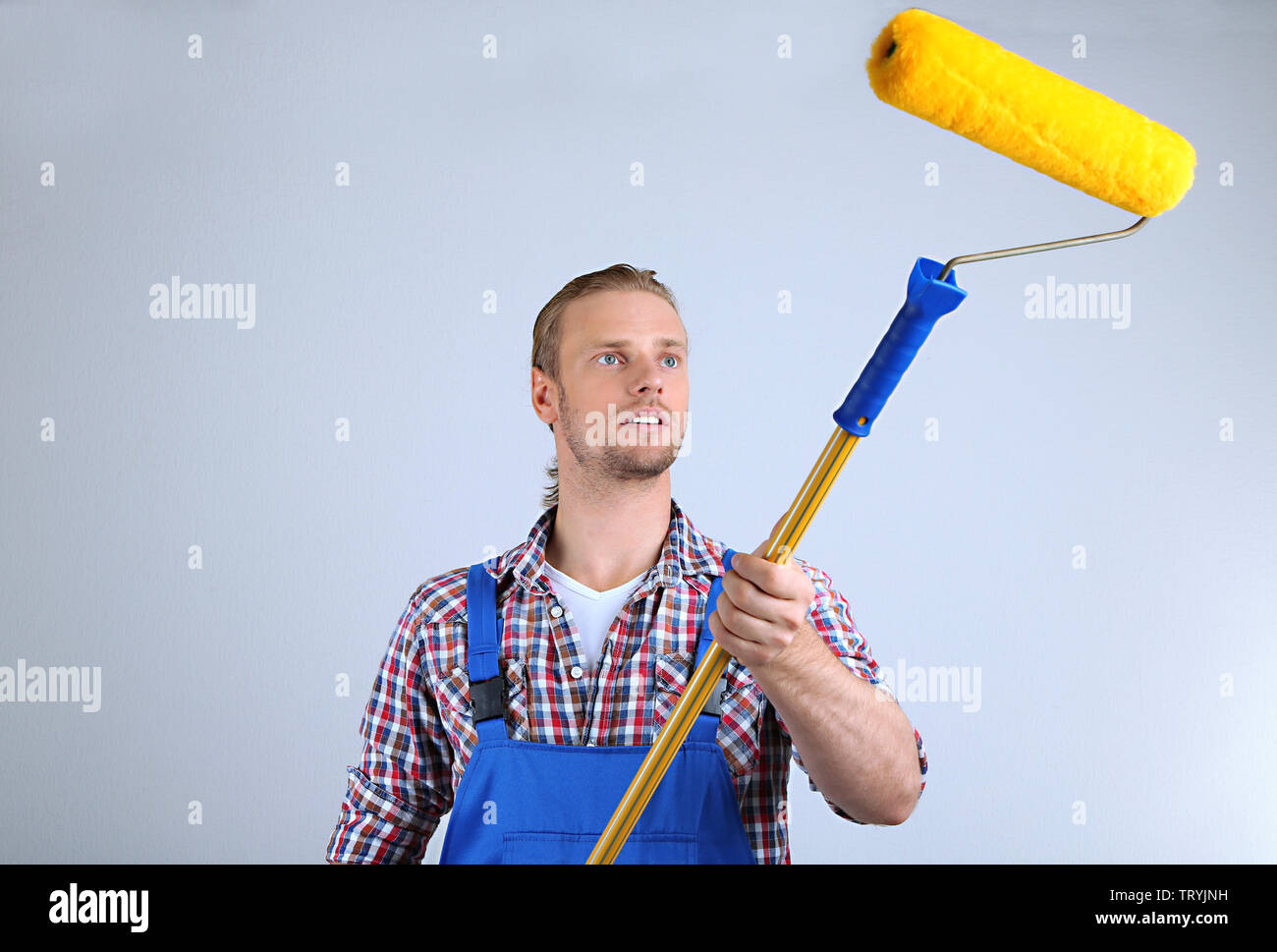 Professional painter in grey uniform hi-res stock photography and ...