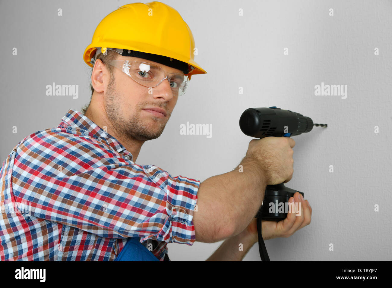 Portrait of young foreman in room Stock Photo - Alamy