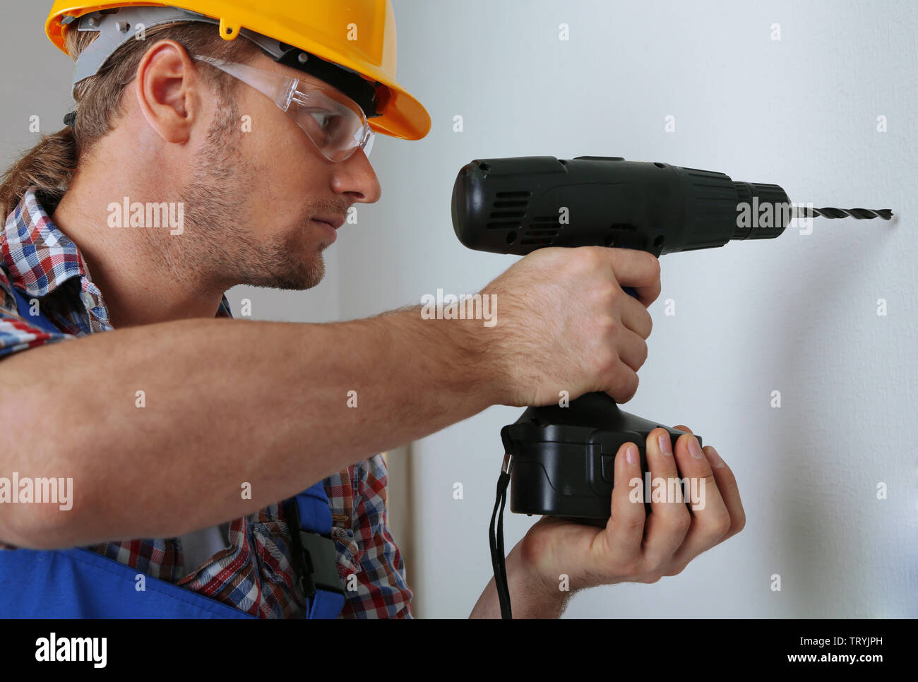 Portrait of young foreman in room Stock Photo - Alamy