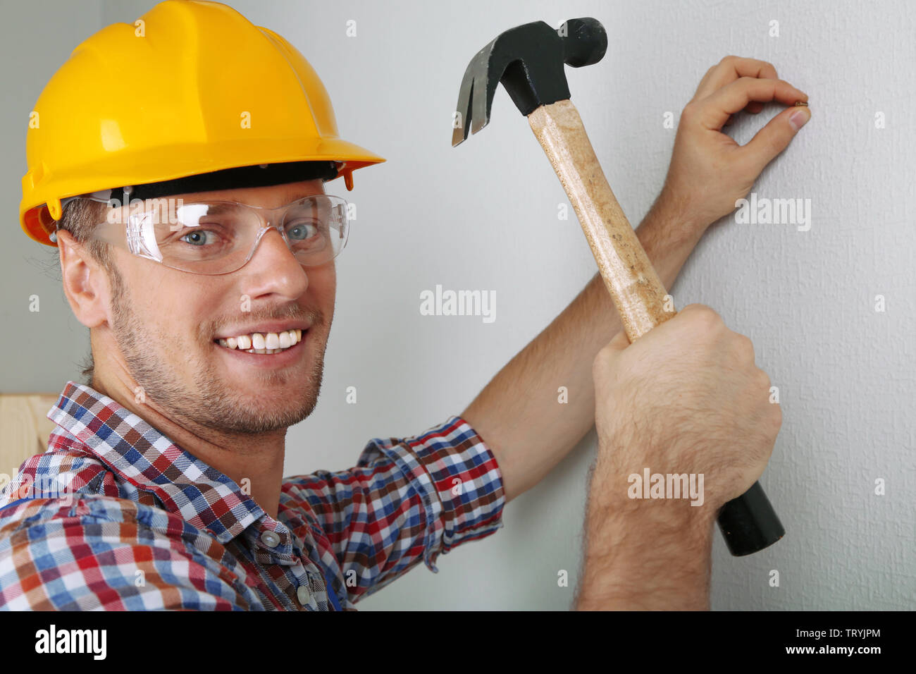 Portrait of young foreman in room Stock Photo - Alamy