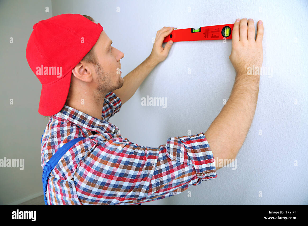 Portrait of young foreman in room Stock Photo - Alamy