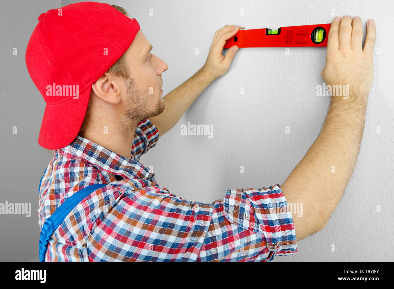 Portrait of young foreman in room Stock Photo - Alamy