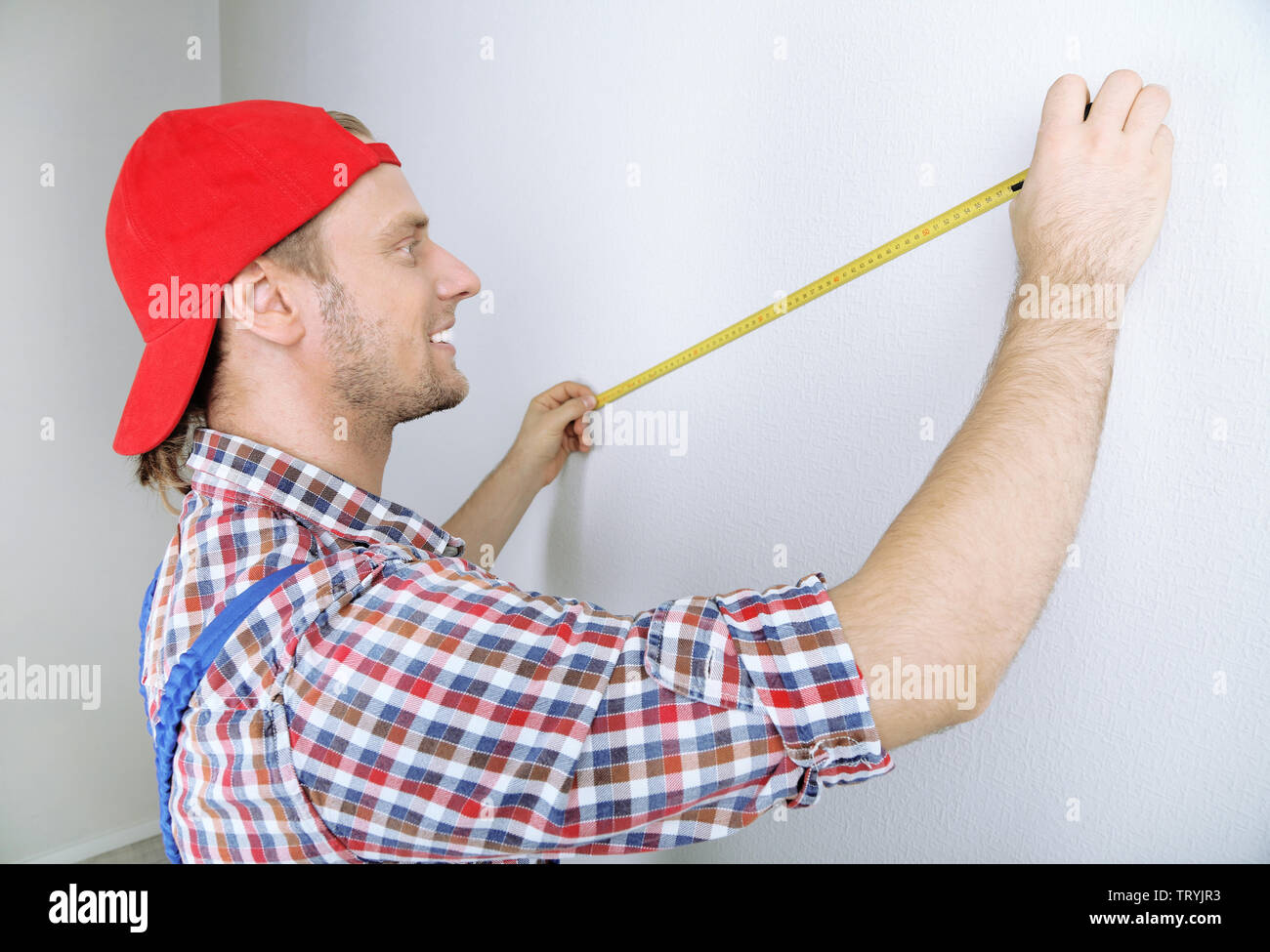 Portrait of young foreman in room Stock Photo - Alamy