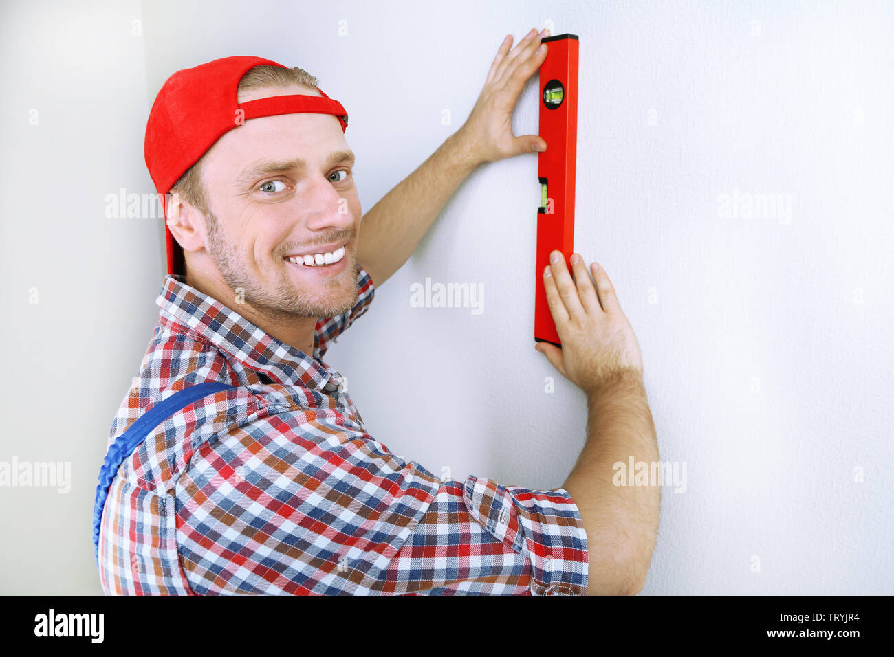 Portrait of young foreman in room Stock Photo - Alamy