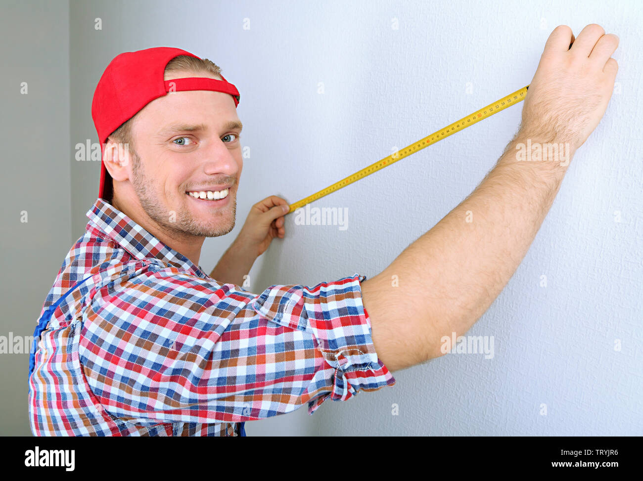 Portrait of young foreman in room Stock Photo - Alamy