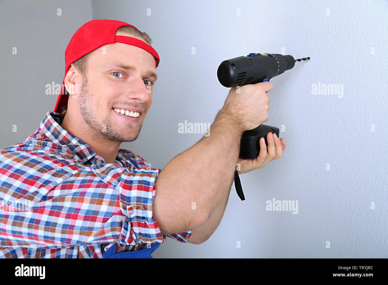 Portrait of young foreman in room Stock Photo - Alamy