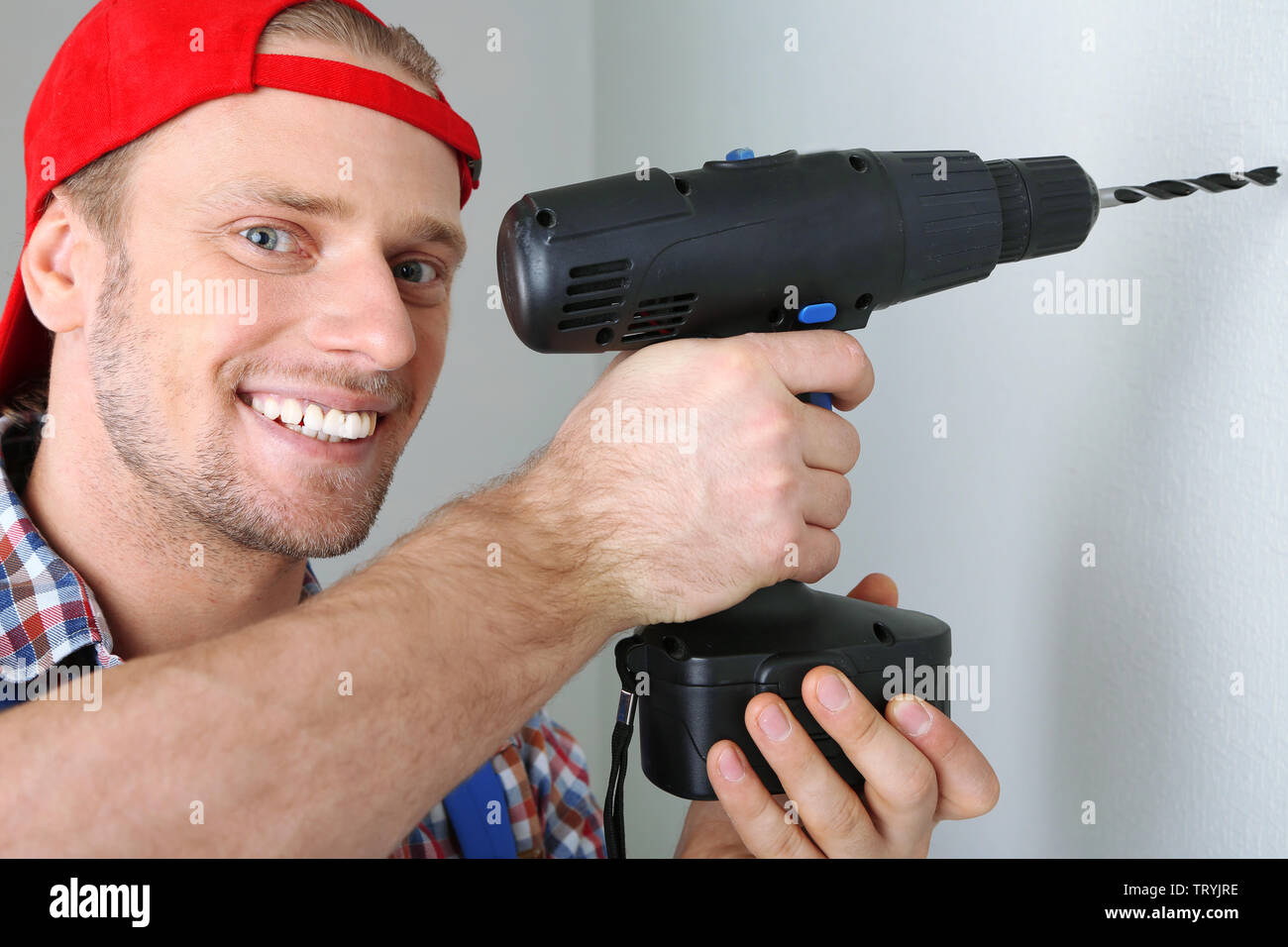 Portrait of young foreman in room Stock Photo - Alamy